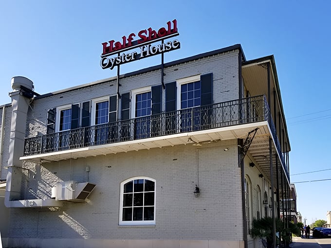 Half Shell's classic balcony screams New Orleans elegance meets Mississippi hospitality. The kind of place where butter is considered a basic food group.