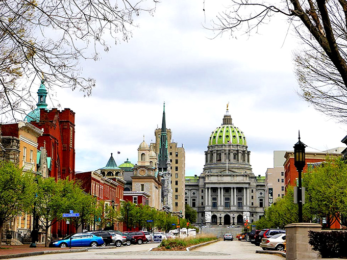 Harrisburg's capitol dome peeks through historic brick buildings, showcasing Pennsylvania's capital city where government jobs support a surprisingly affordable community.