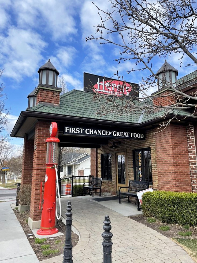 Herm's Inn's vintage gas pump stands sentinel, reminding us that filling your tank once meant filling your stomach too.