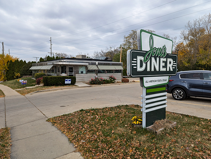 Joni's Diner sign gleams in the autumn light, a silver beacon calling hungry travelers to breakfast paradise.
