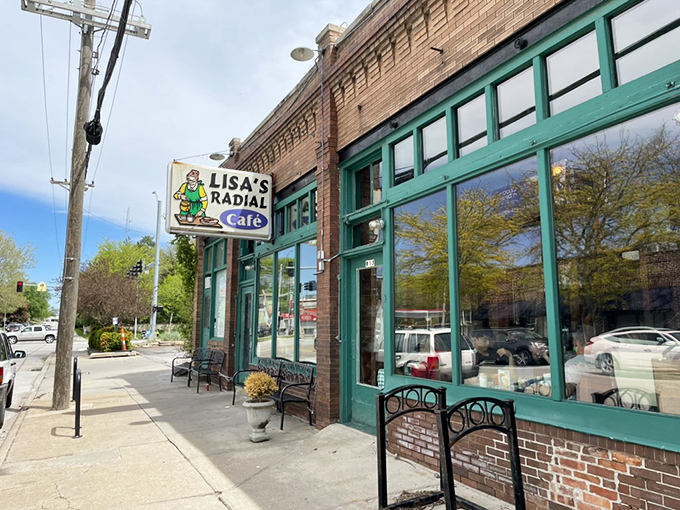 Lisa's Radial Caf&eacute;'s green-trimmed windows frame a breakfast institution. That little chef on the sign has been witnessing morning happiness for years.