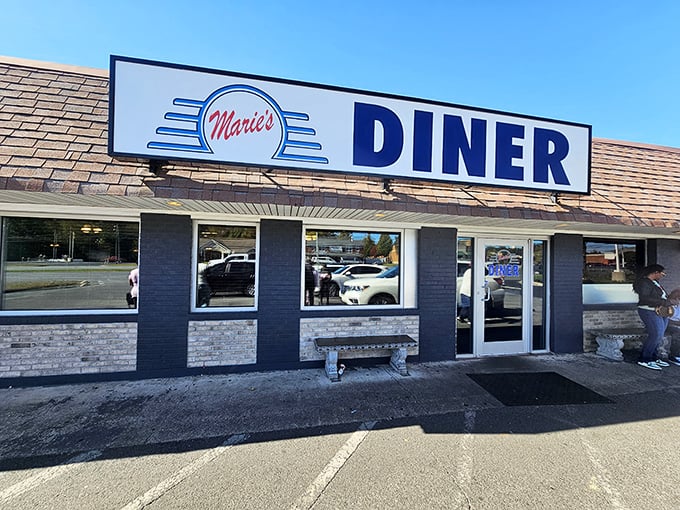 Marie's Diner's blue and white facade stands ready to serve, like a culinary lighthouse guiding hungry travelers to breakfast bliss.