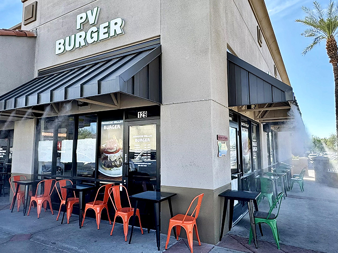PV Burger's sleek exterior and colorful outdoor seating invite you in for a burger adventure. Modern meets classic in this strip mall standout.