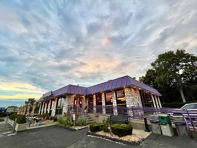 Shoreline Diner exterior: "Sunset casts magic hour glow on this stone-clad diner. The dramatic sky is just a preview of the dramatic flavors waiting inside."