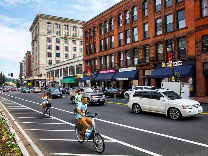Cyclists glide through Springfield's revitalized downtown, where historic buildings wear bright awnings like colorful party hats.