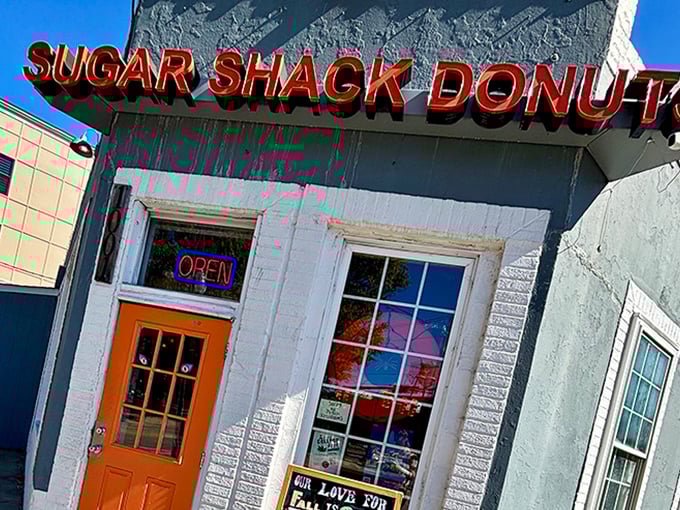 Sugar Shack's vibrant red sign pops against the gray building&mdash;like their flavors pop in your mouth!