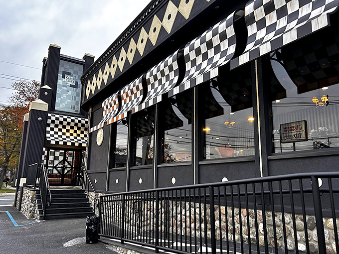 The Chit Chat Diner's checkerboard exterior is like a chess game where everyone wins, especially your taste buds.