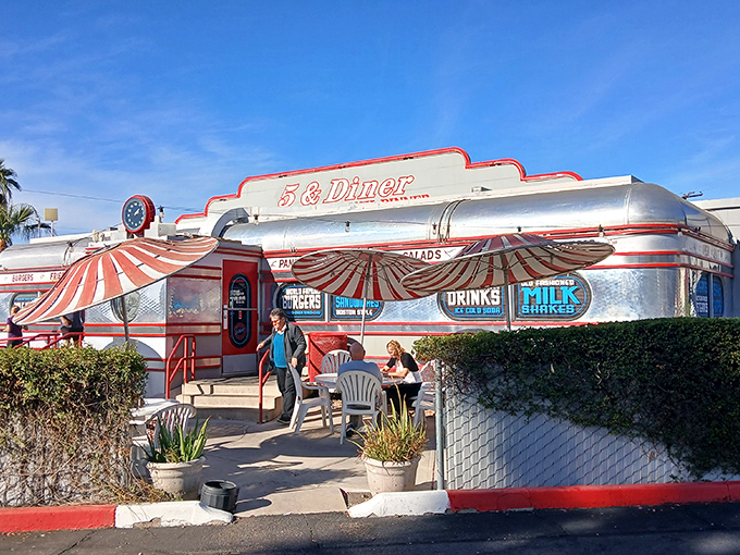 Shiny, happy diner! The 5 & Diner's metallic exterior reflects both the sun and America's love affair with classic comfort food.