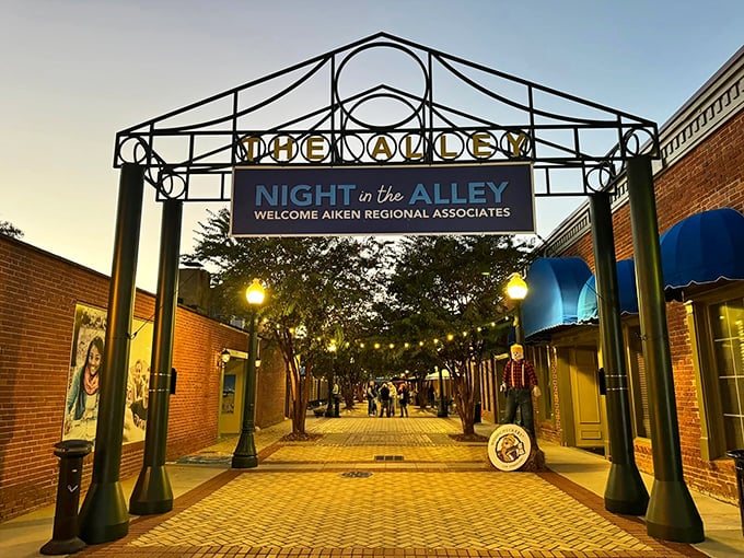 String lights twinkle above The Alley in downtown Aiken, where evening strolls cost nothing but create priceless memories.