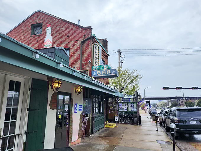 Rain or shine, Broadway Oyster Bar's iconic sign beckons seafood enthusiasts. This St. Louis landmark has been serving up New Orleans vibes for generations!
