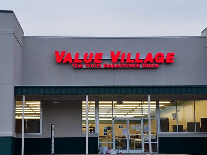 The bright red Value Village sign promises a treasure hunt worth the trip. Inside, aisles of possibilities await the patient bargain seeker.