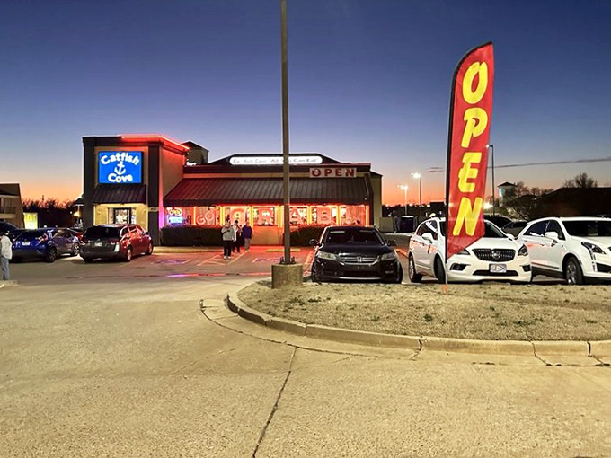 As the sun sets, Catfish Cove lights up like a seafood lighthouse, guiding hungry travelers to all-you-can-eat catfish heaven.