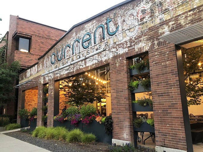 String lights and lush planters frame Current's inviting entrance. Like finding a secret coastal bistro hiding in downtown Salt Lake!