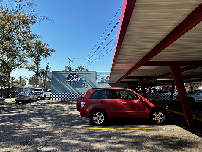 Under that nostalgic sign, pancakes stack higher than your weekend plans and coffee refills flow like conversation.