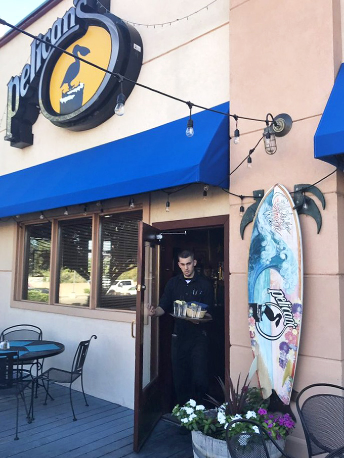 Coastal charm meets desert dining at Pelican's. That surfboard isn't just decoration &ndash; it's a promise of ocean flavors!