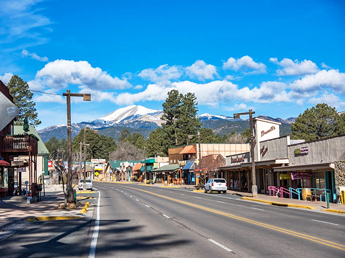 Snow-capped Sierra Blanca watches over Ruidoso's main street, where mountain charm meets small-town hospitality.