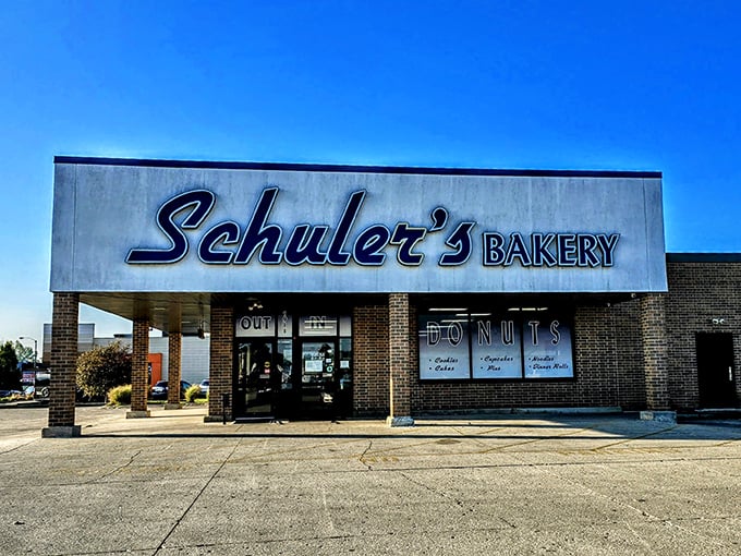 Under clear blue Ohio skies, Schuler's Bakery stands ready to fulfill its sugary destiny. The "IN/OUT" signs are merely a formality.