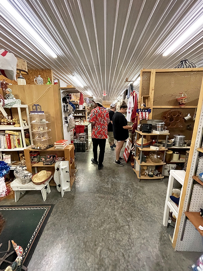 Narrow aisles create a treasure maze where vintage Coca-Cola signs neighbor delicate glassware in this New Market wonderland.