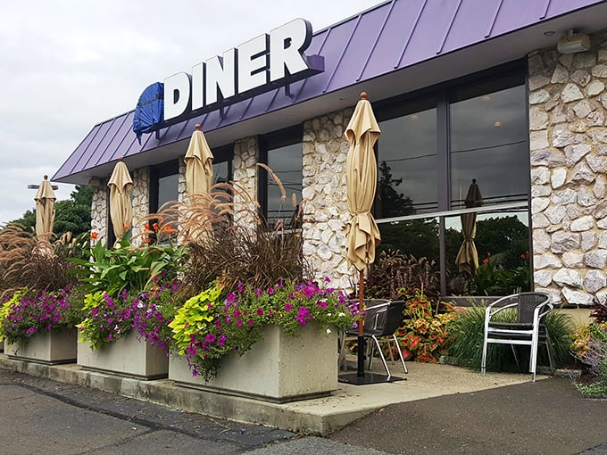 Shoreline Diner entrance: "Garden boxes bursting with color frame this modern take on diner tradition&mdash;beautiful outside, but the real masterpieces are on your plate."