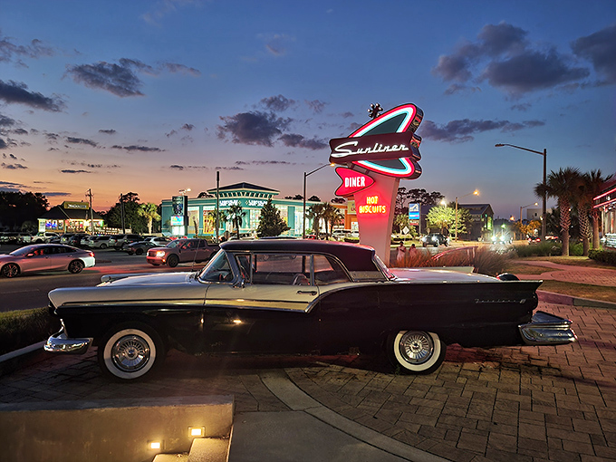 As twilight falls, Sunliner Diner glows like a neon dream, with vintage cars that make you wonder if The Fonz might show up for pancakes.