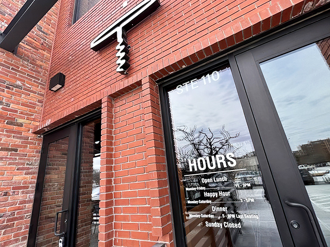 The restaurant's entrance promises a dining experience where farm-to-table meets sea-to-plate in suburban Omaha.