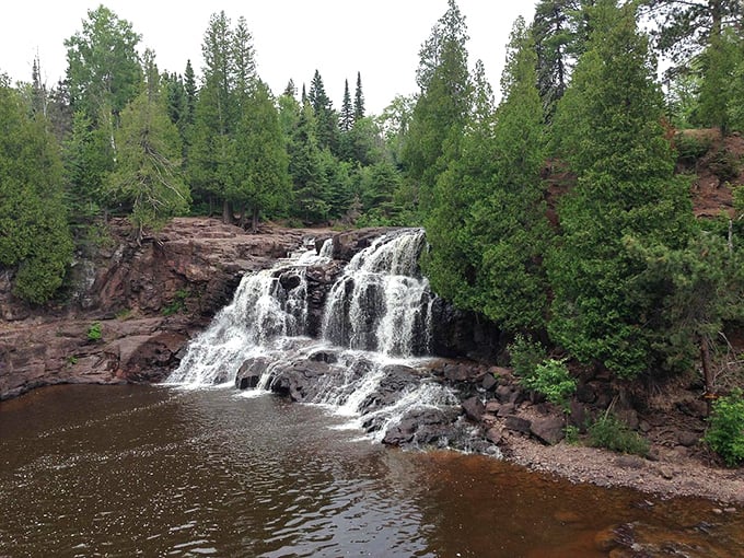 Nature showing off again! This waterfall view makes you wonder why anyone would choose a beach vacation instead.