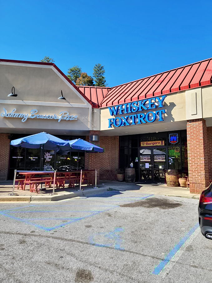 The red metal tables outside Whiskey Foxtrot are like front-row seats to the best burger show in Hoover.