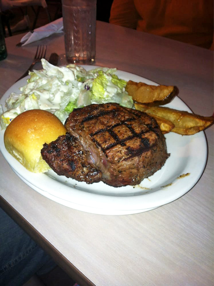 This isn't just dinner; it's a masterclass in proper steak preparation, complete with textbook grill marks that would make a geometry teacher proud.