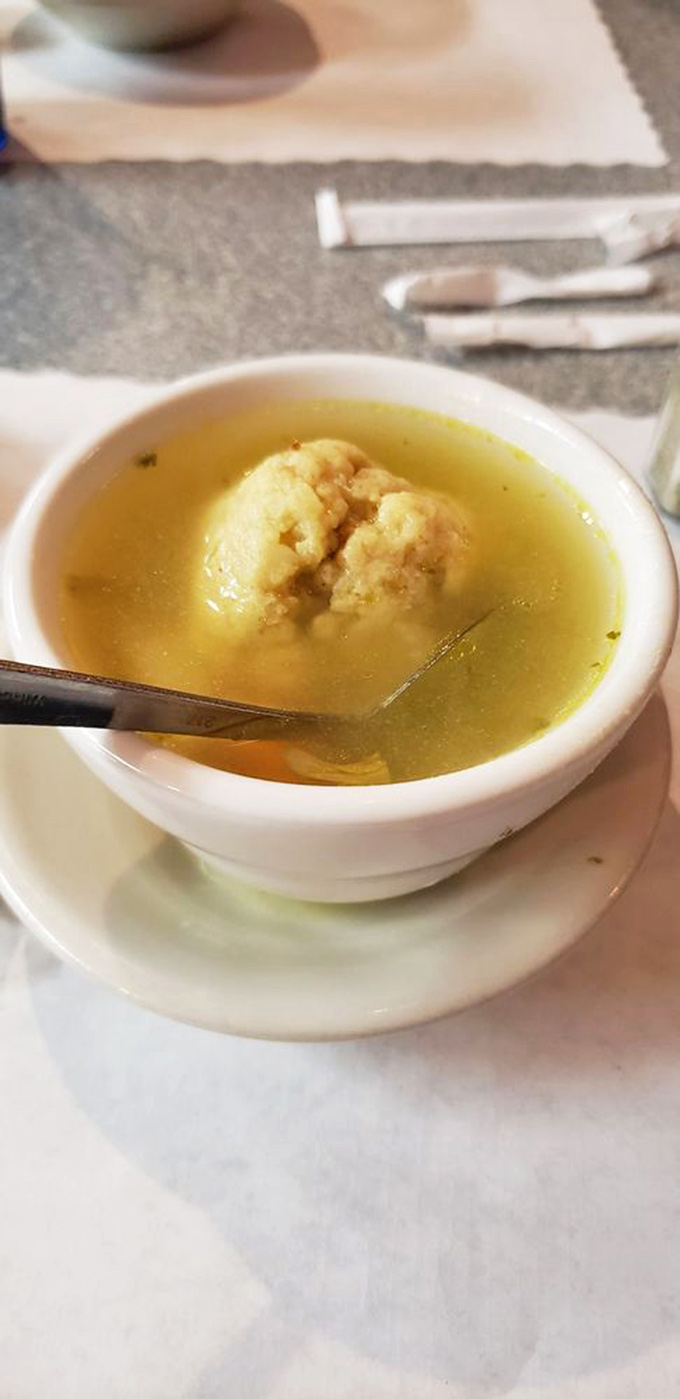 Liquid gold with a fluffy cloud of comfort. This matzo ball isn't floating&mdash;it's holding court in a broth fit for royalty.