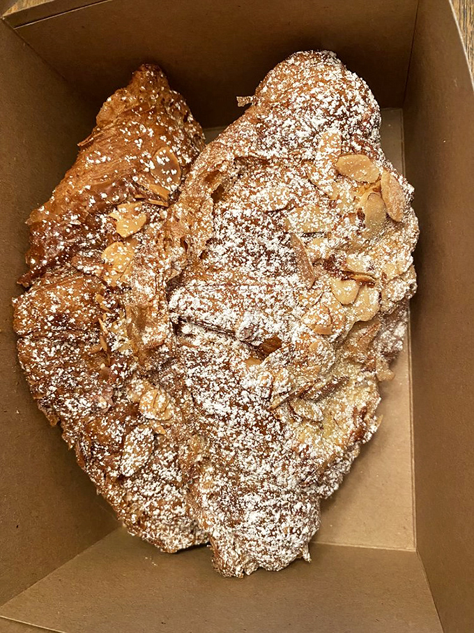 These almond croissants deserve their own zip code. Dusted with powdered sugar and studded with sliced almonds, they're architectural marvels of the pastry world.