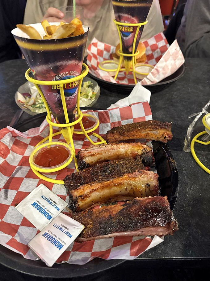 These ribs aren't just falling off the bone—they're practically defying gravity. Served with cosmic fries in a contraption that looks like it could beam you up.