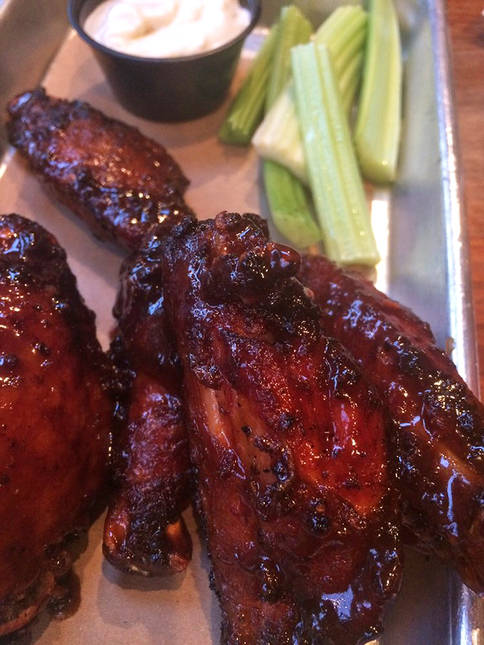 These wings aren't just smoked, they're having a full-blown love affair with fire and spice. The celery is just there as a witness.