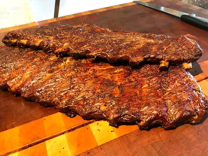 These ribs aren't just cooked&mdash;they're transformed through smoke alchemy into something that makes grown adults close their eyes in reverence.
