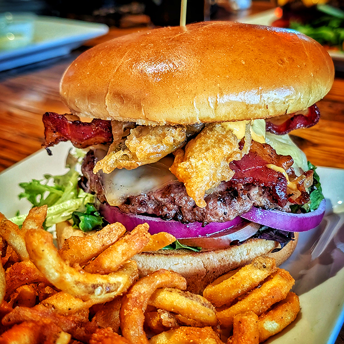 This isn't just a burger, it's intergalactic indulgence &ndash; towering with bacon, crispy onions, and all the fixings alongside perfectly golden fries.