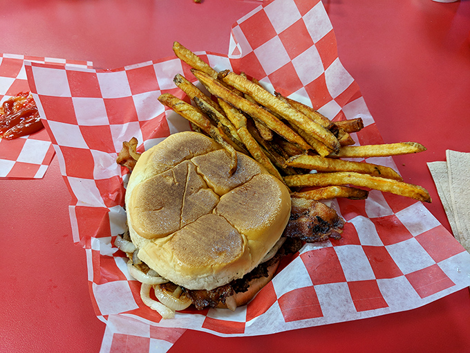 This isn't just lunch; it's edible architecture&mdash;a perfectly stacked burger alongside fries that were potatoes just moments ago.