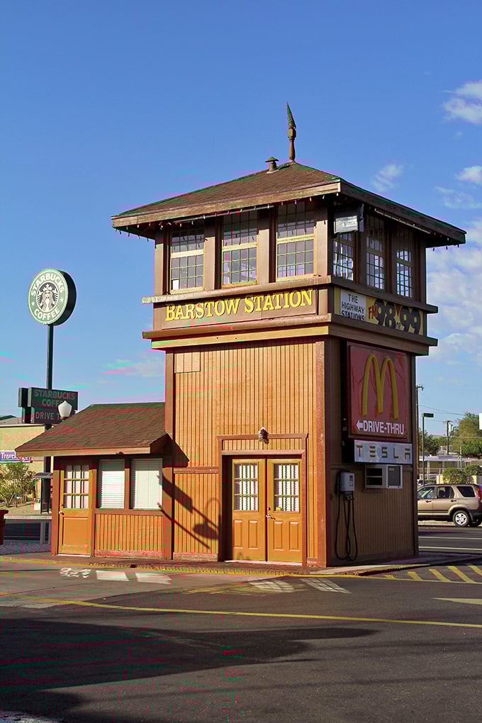 The iconic Barstow Station tower stands as a quirky landmark where travelers can grab coffee, fast food, and a Tesla charge&mdash;desert convenience with a side of character.
