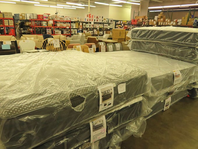 Sleep like royalty without the royal price tag &ndash; premium mattresses stacked high, each one promising better dreams than the last.