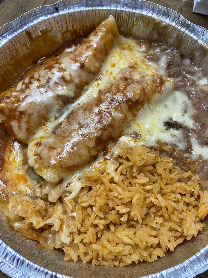These enchiladas aren't just covered in cheese&mdash;they're embraced by it. The rice isn't a side dish; it's an essential supporting character in this delicious story.