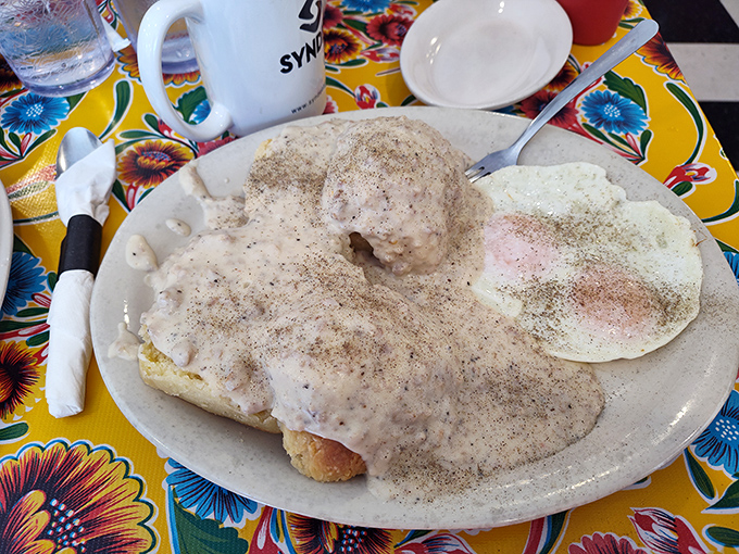 Biscuits and gravy so creamy they should require a permission slip. That pepper-speckled blanket of comfort isn't just breakfast, it's therapy.