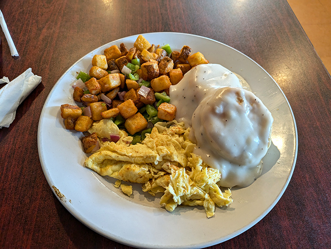 Breakfast nirvana achieved! Golden home fries mingling with scrambled eggs and country gravy&mdash;the breakfast equivalent of a warm hug.