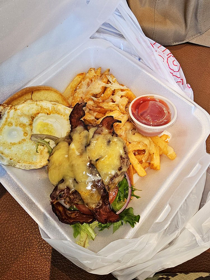Chicken and waffles? No, that's a breakfast masterpiece stacked higher than my morning expectations, complete with powdered sugar snowfall.