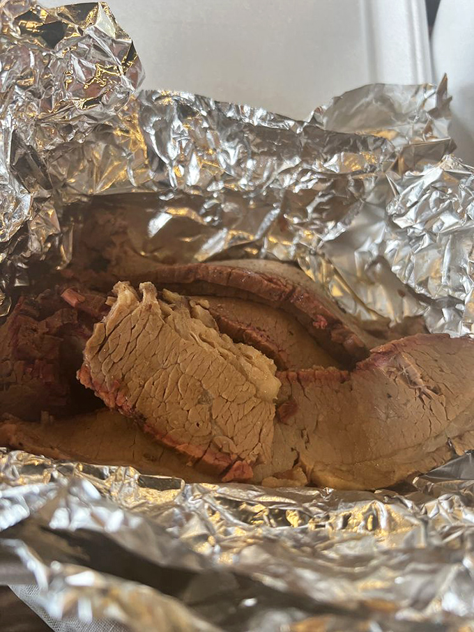 Brisket so tender it practically surrenders at the sight of your fork, wrapped in foil like the precious gift it is.