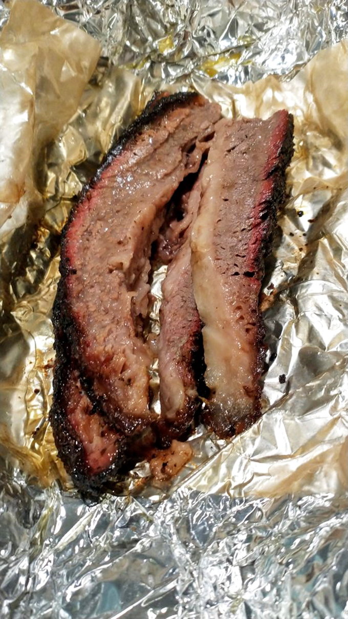 Behold the brisket in all its glory&mdash;that smoke ring isn't just for show, it's nature's way of saying "you're welcome" to your taste buds.