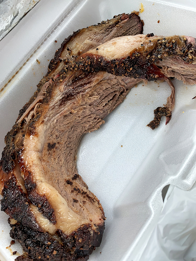 Brisket with a bark so perfect it deserves its own standing ovation. That smoke ring isn't just for show&mdash;it's a flavor halo.