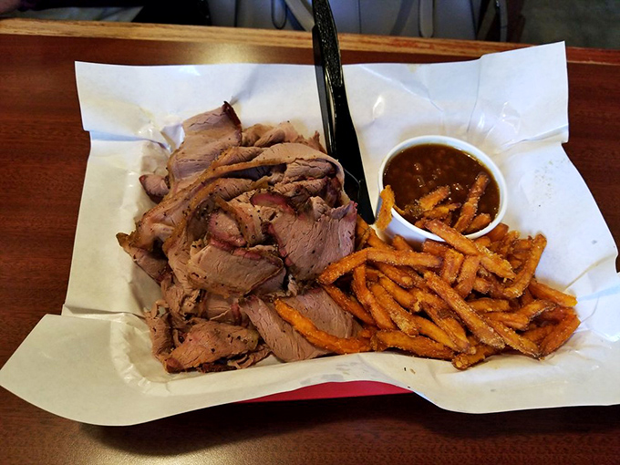 Brisket so tender it practically surrenders at the sight of your fork, paired with sweet potato fries that crunch like autumn leaves.