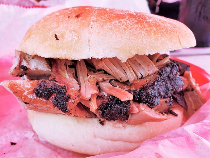 This isn't just a sandwich; it's a monument to patience. Brisket with bark so perfect you'll want to frame it before devouring every last morsel.