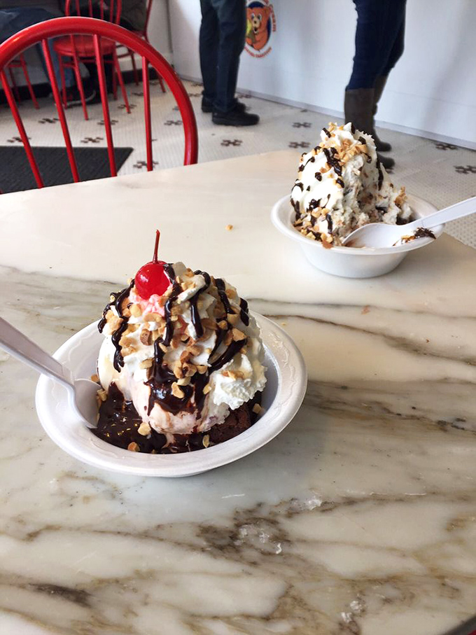 Two sundaes, infinite joy. The hot fudge and nuts create that perfect symphony of textures that makes you temporarily forget your adult responsibilities.