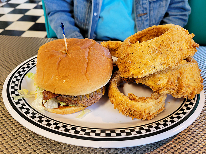 This isn't just a burger&mdash;it's architectural perfection. The golden-battered onion rings play supporting role to a star that needs no introduction.