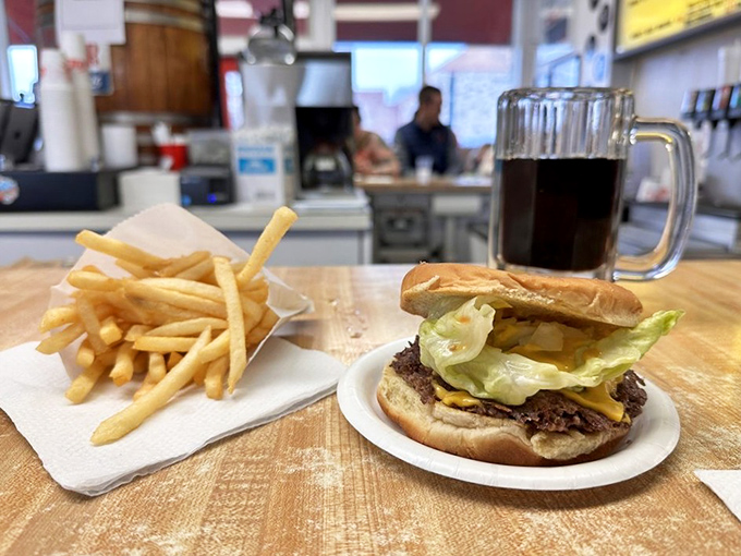 This isn't just lunch; it's a flavor symphony where crispy-edged patties, golden fries, and a frosted mug of root beer play the classics.