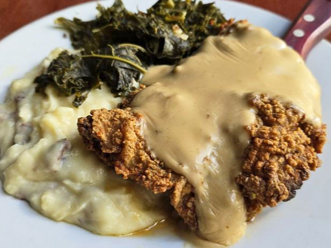 Behold the legendary chicken fried steak! That golden-brown crust shatters with each bite, revealing tender meat beneath its peppery gravy blanket.